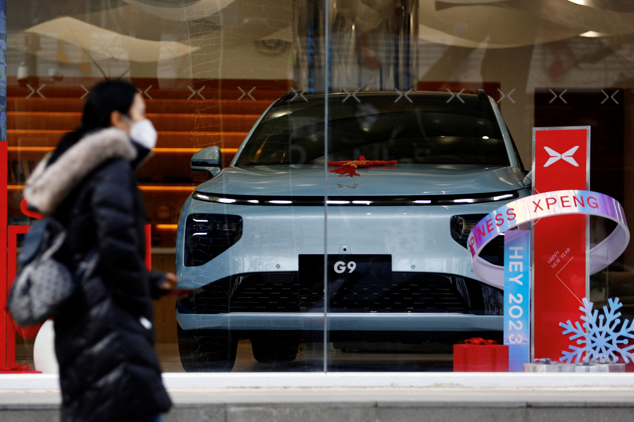 In China, Tesla could win electric vehicle price battle – but lose the ...