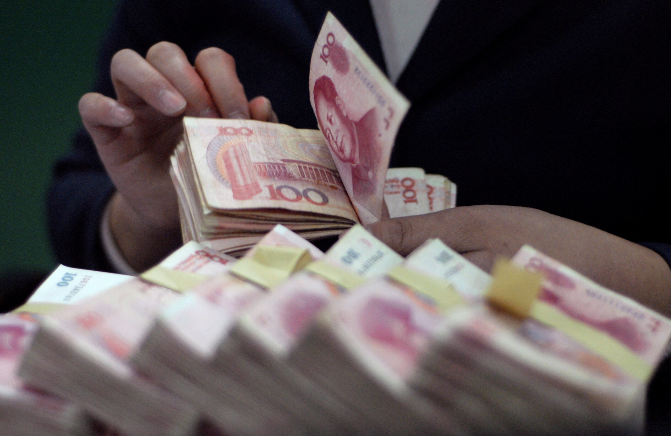 Smaller Chinese banks cut deposit rates on squeezed margins | Inquirer ...