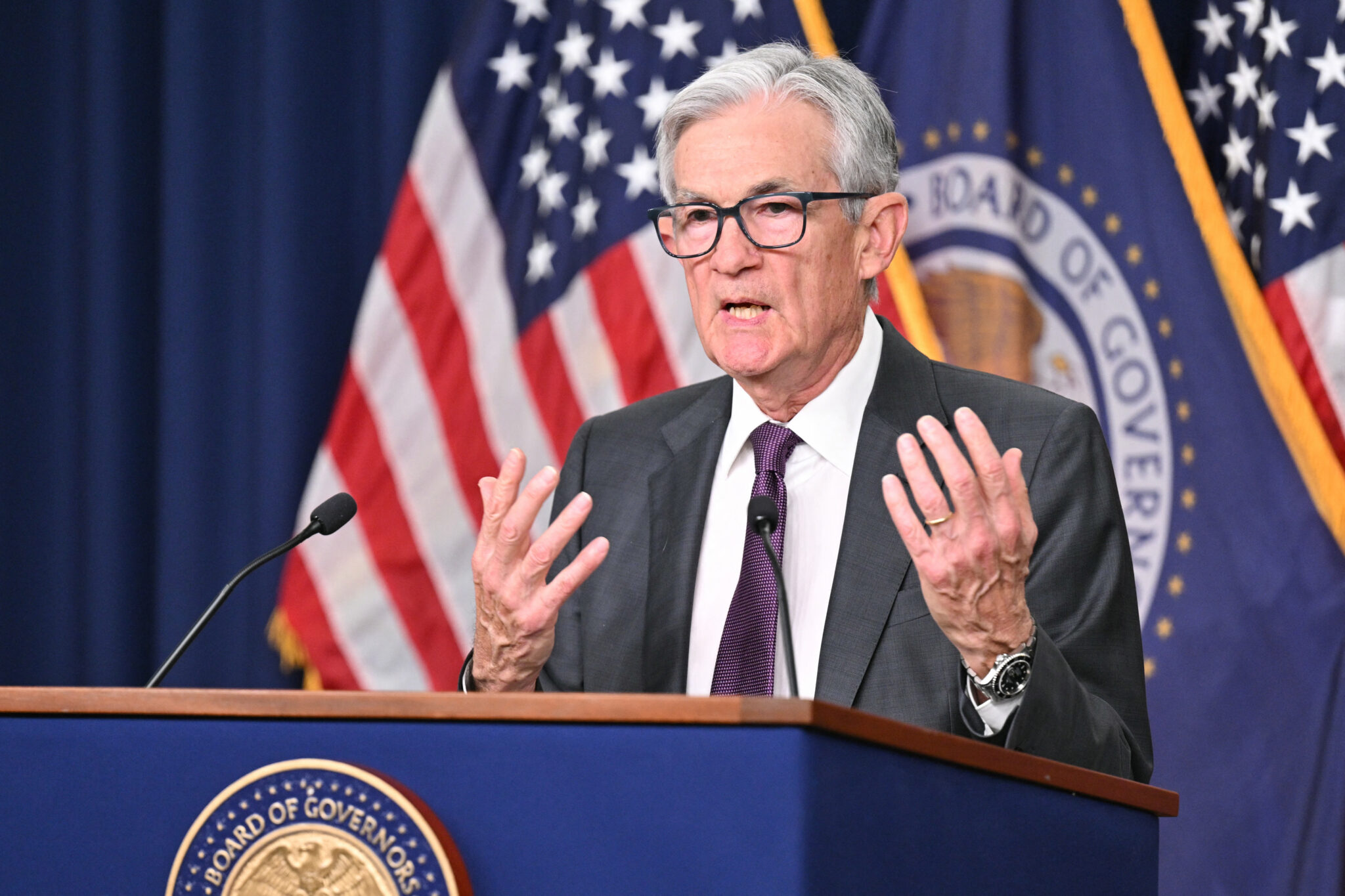 Gold hits record, stocks slip as Trump fuels Fed fears