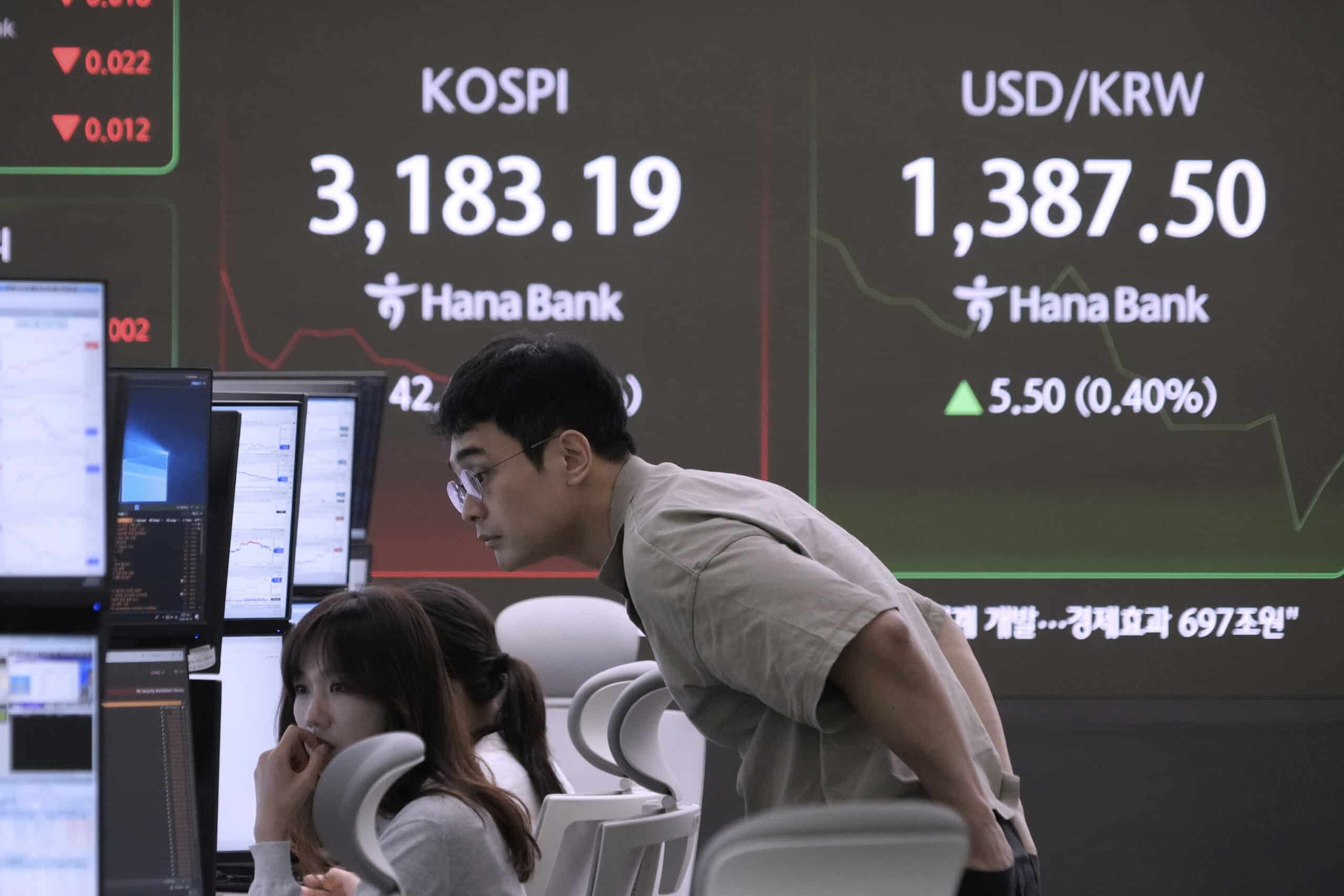 Asian shares mostly higher on Monday